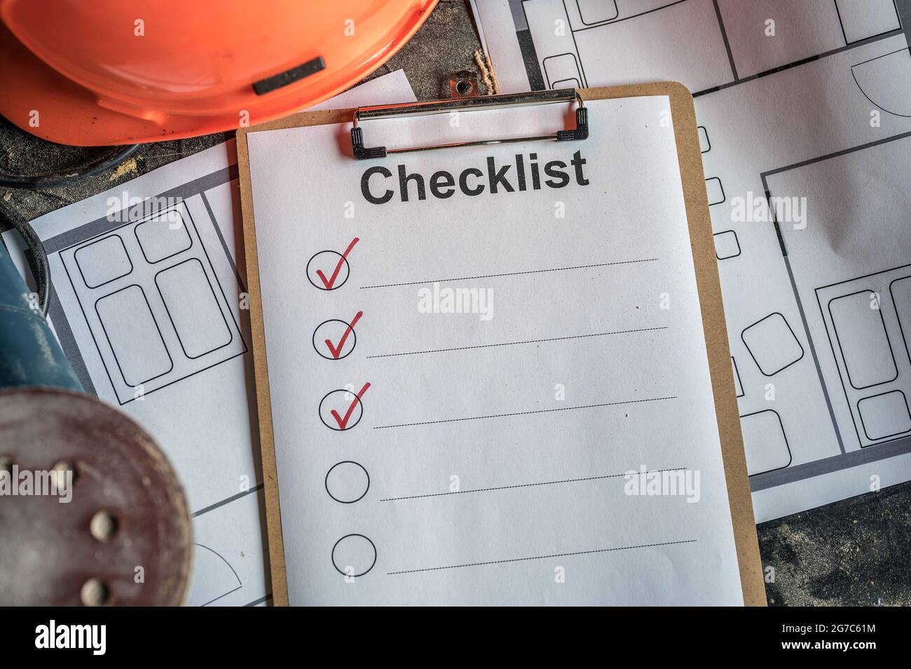 Planning a house construction with a checklist and checked and ...