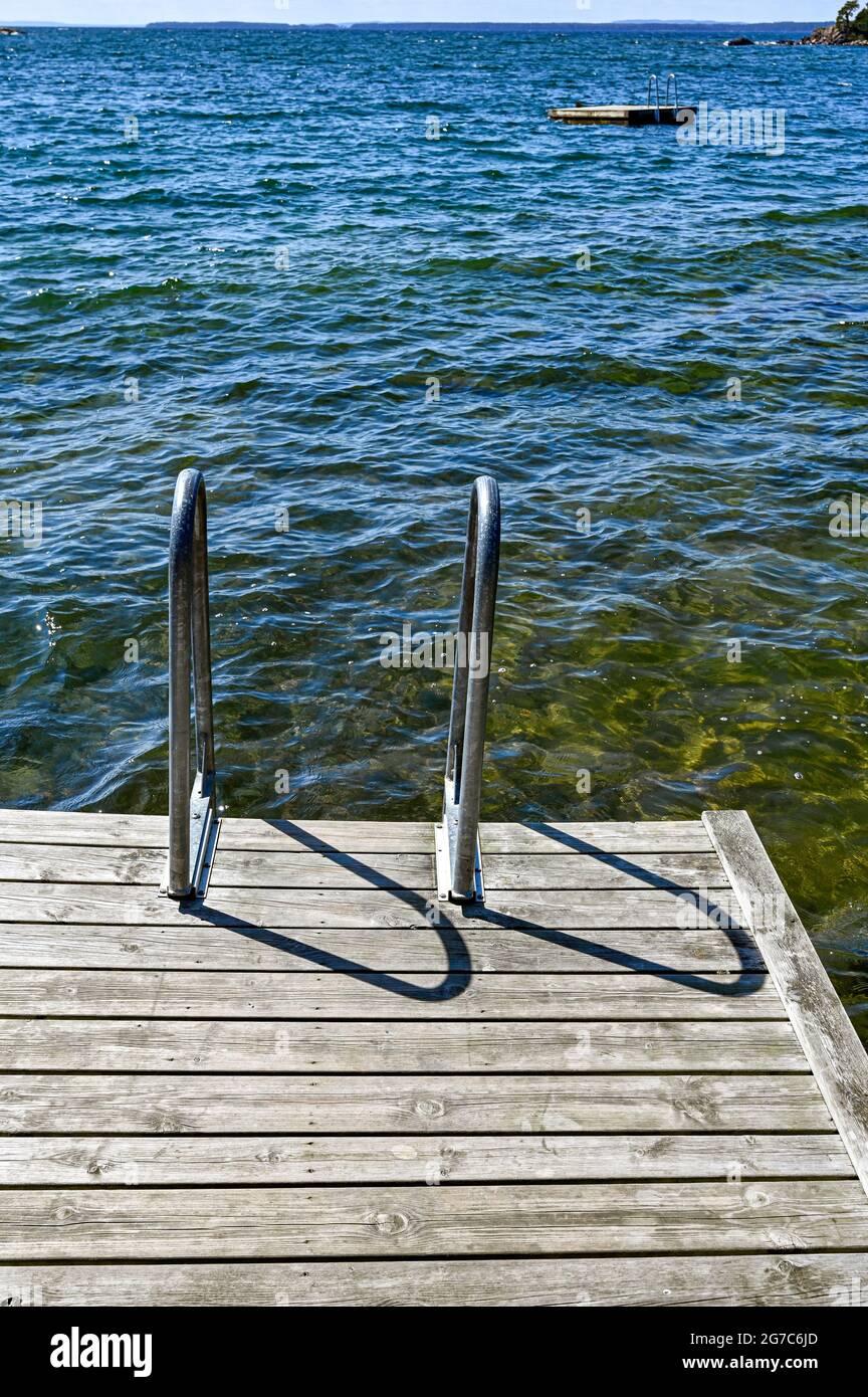 jetty with bathing ladder in lake Vattern Sweden Stock Photo - Alamy