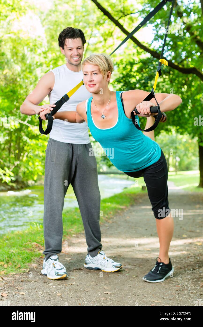 Woman personal trainer park hi-res stock photography and images - Alamy