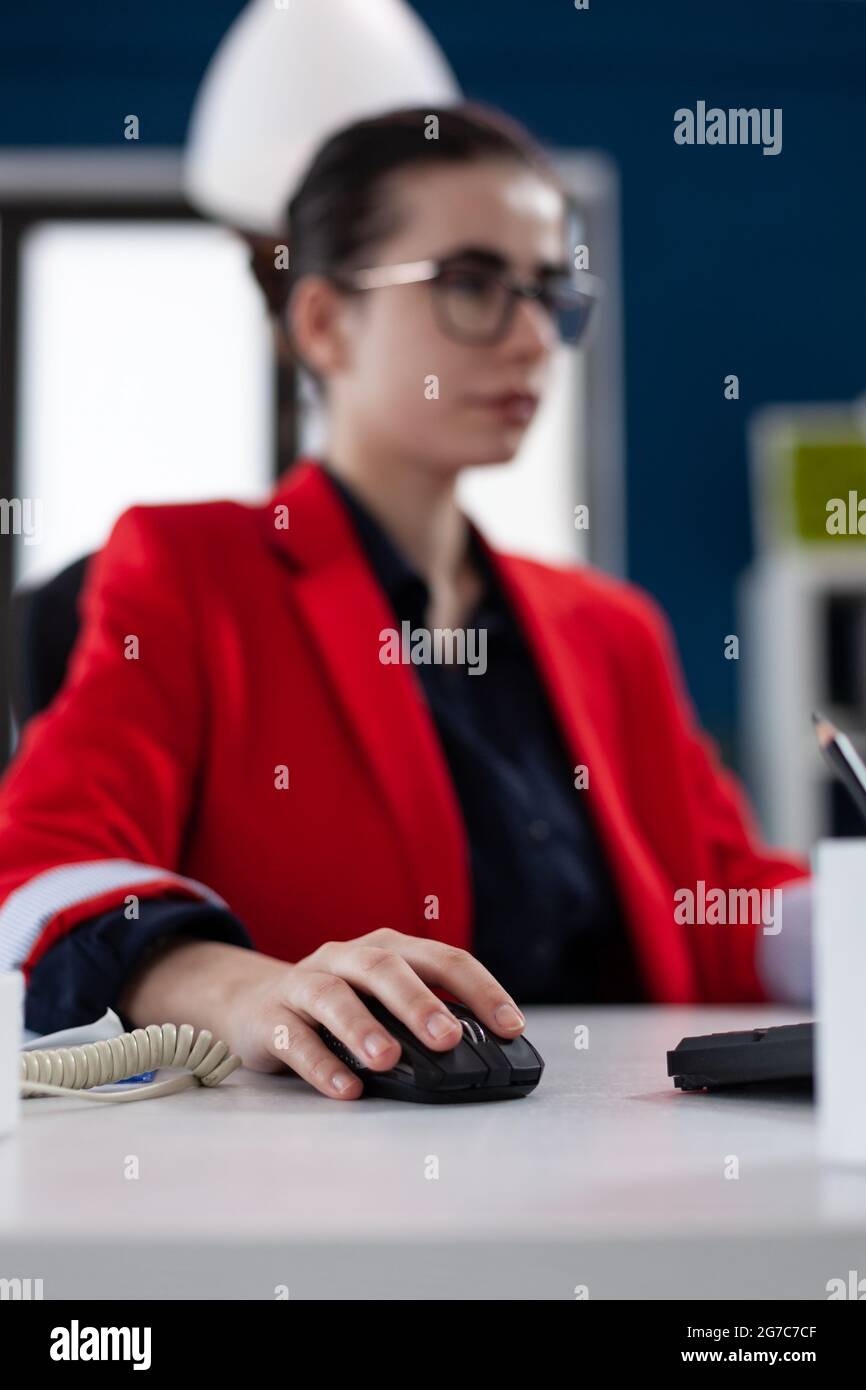 Focus on hand of businesswoman holding computer mouse working in ...