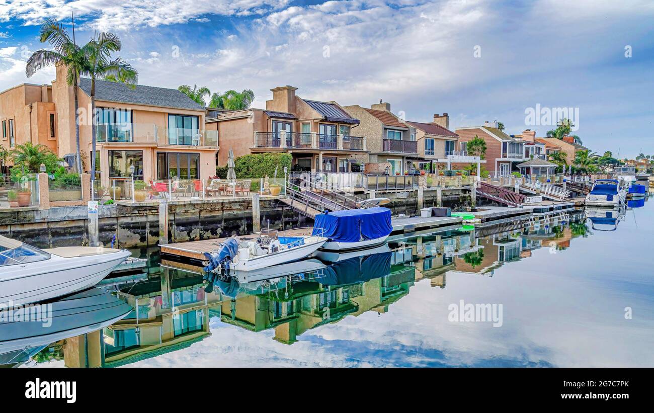 Pano Amazing waterfront landscape with houses docks and boats under ...