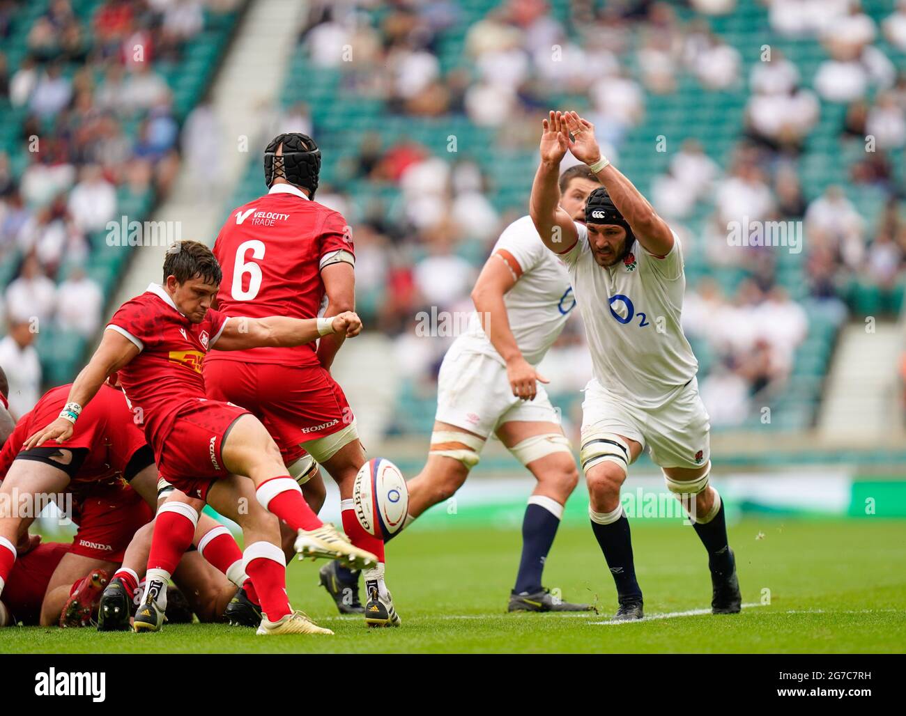 England lock Harry Wells attempts to charge down a kick from Rugby ...