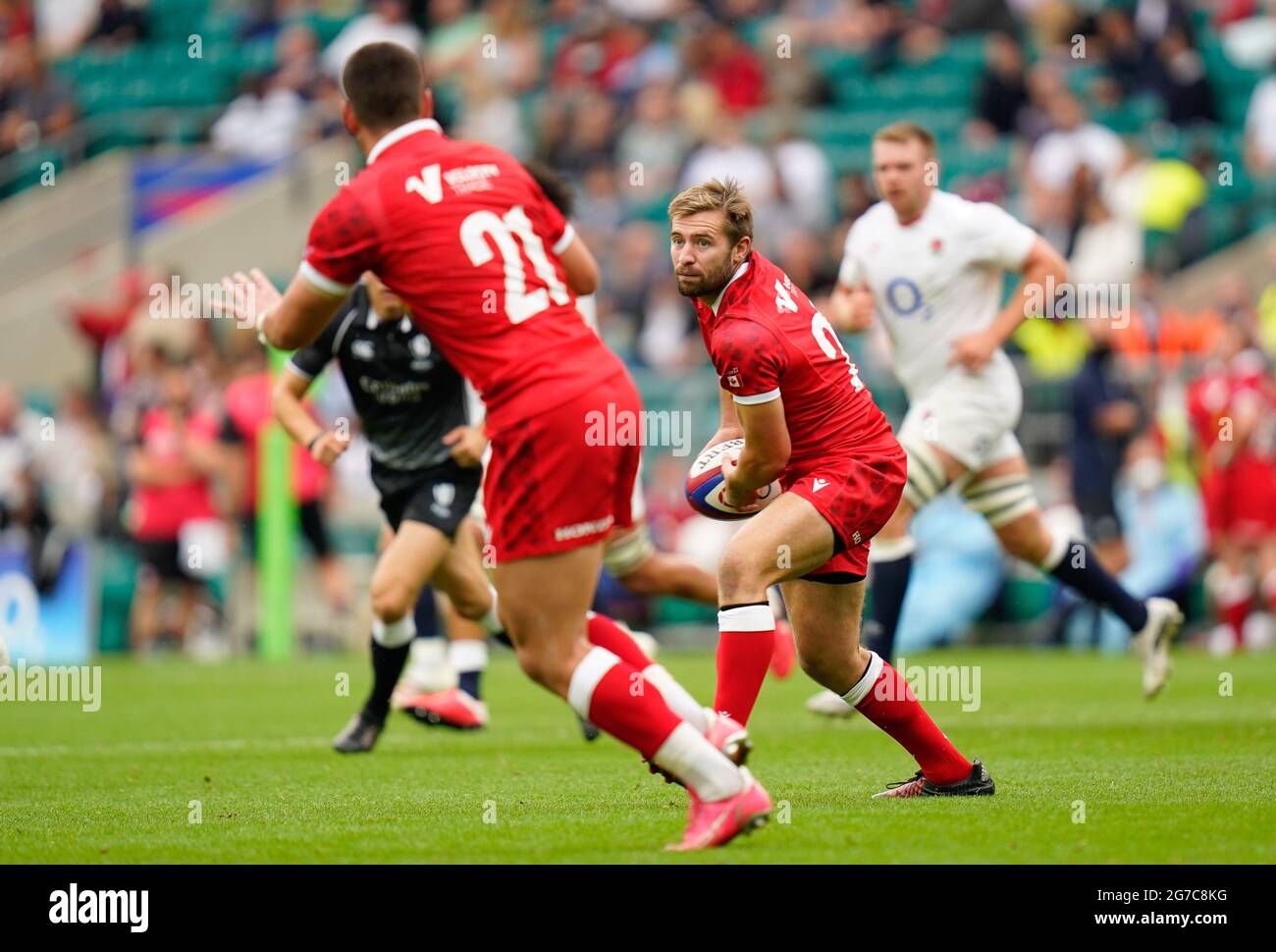 Rugby Canada’s Robbie Povey passes to Quinn Ngawati during the England ...