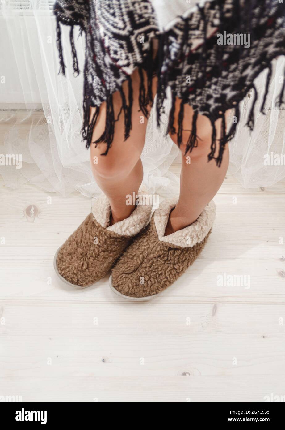 Female feet in warm slippers hi-res stock photography and images - Alamy