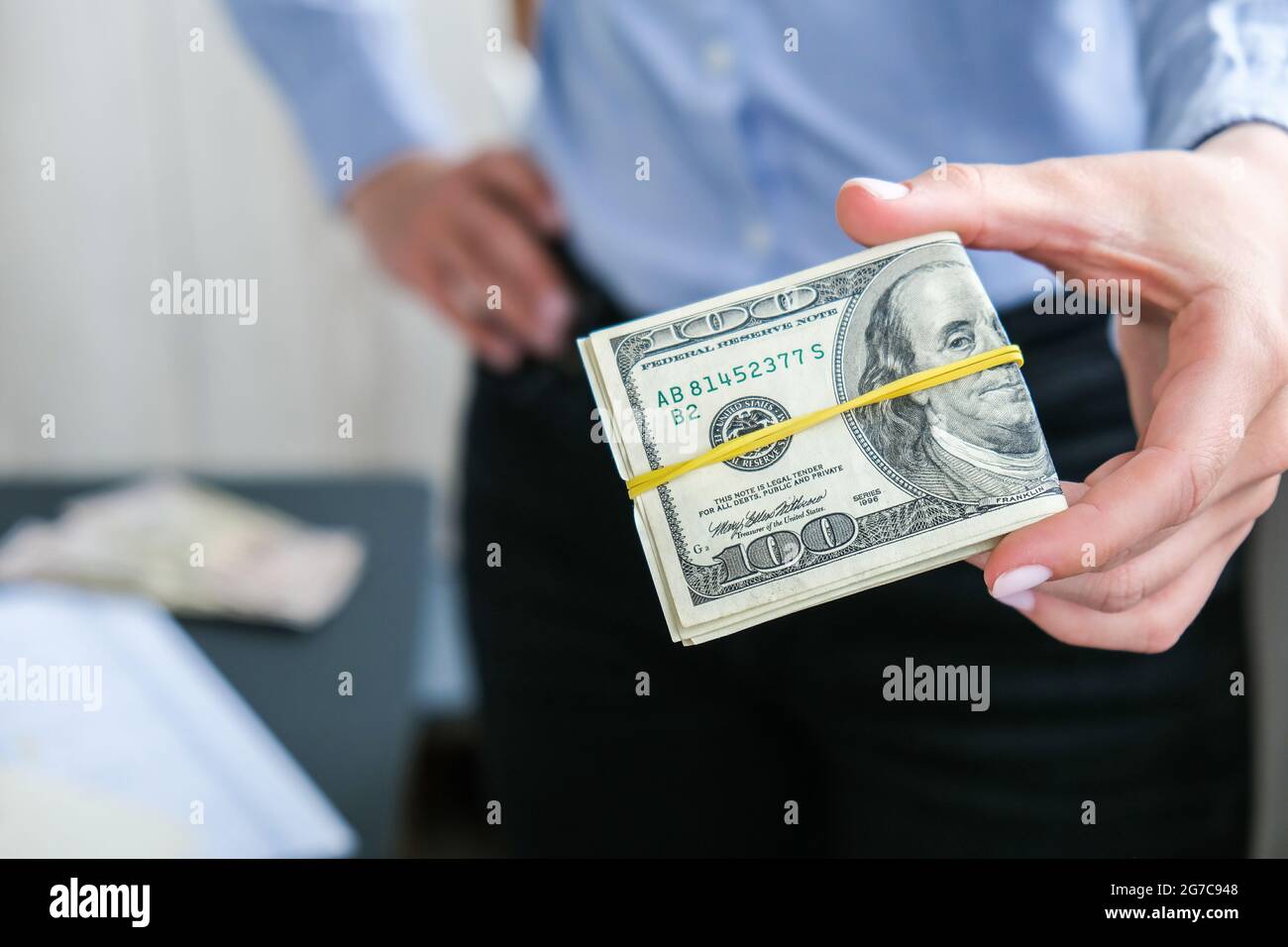 Business Woman Displaying a Spread of Cash US dollars. Close-up. Income ...