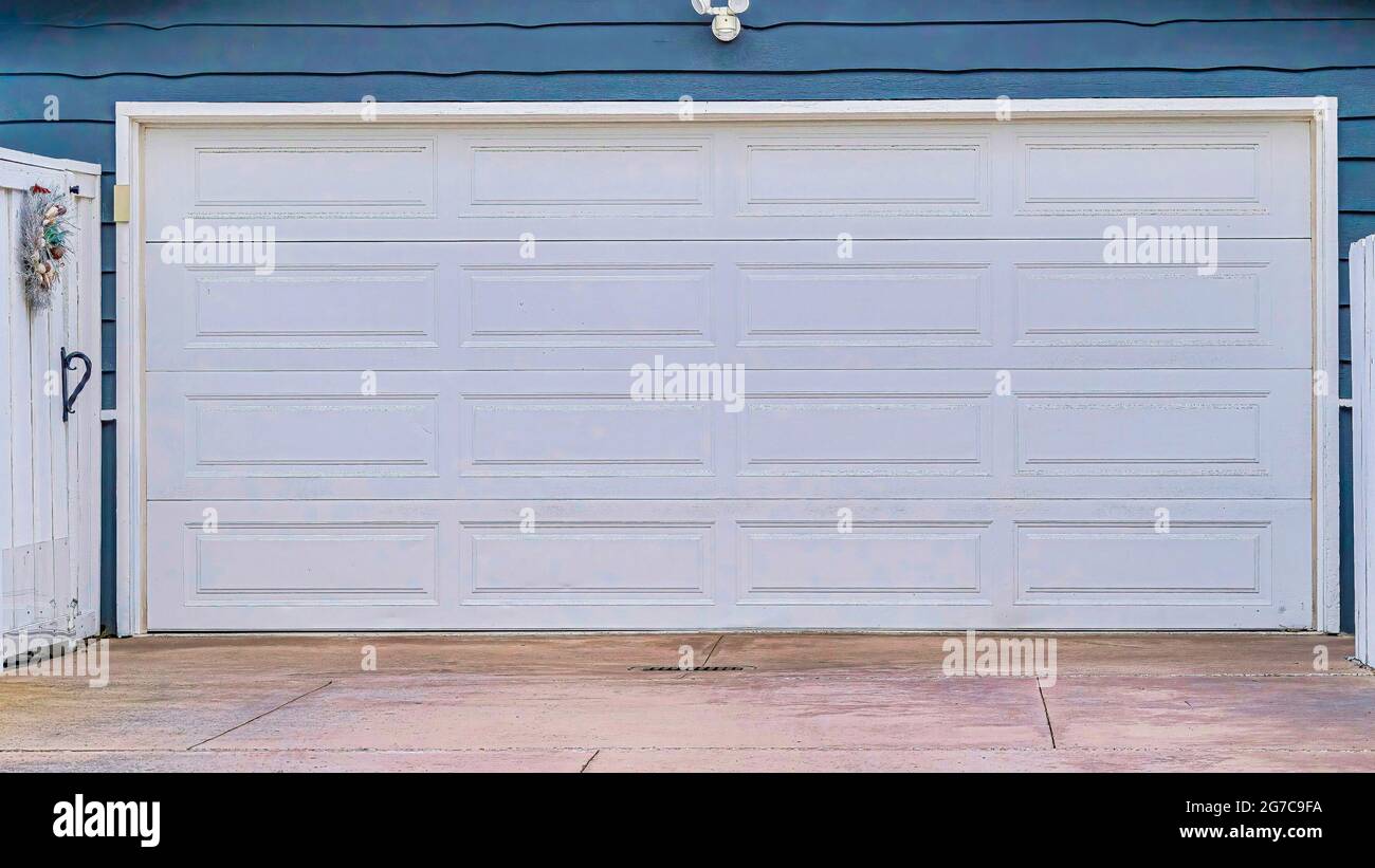 Pano Garage with gable roof over white door and gray wall in San Diego ...