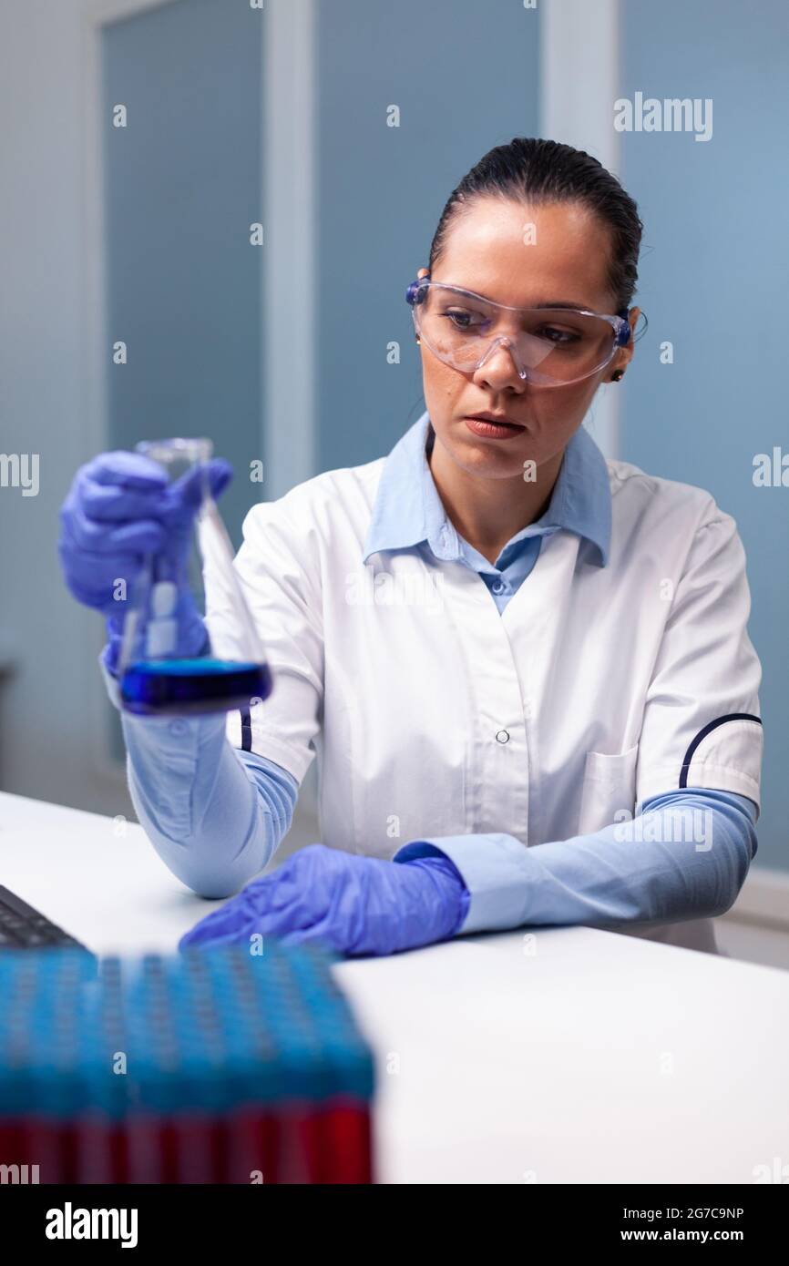 Scientist woman researching microbiology disease solution analyzing ...