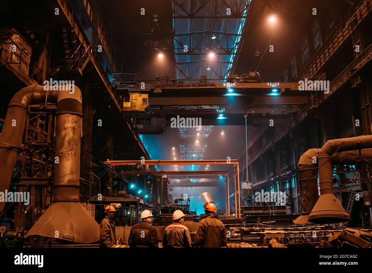 Foundry workshop. Metallurgical plant with unrecognizable workers ...