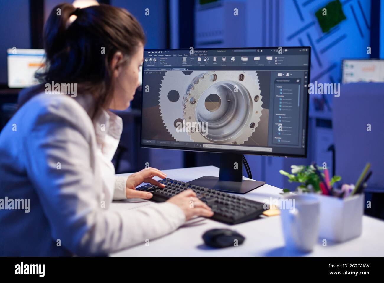 Woman engineer working on new digital prototype using professional ...