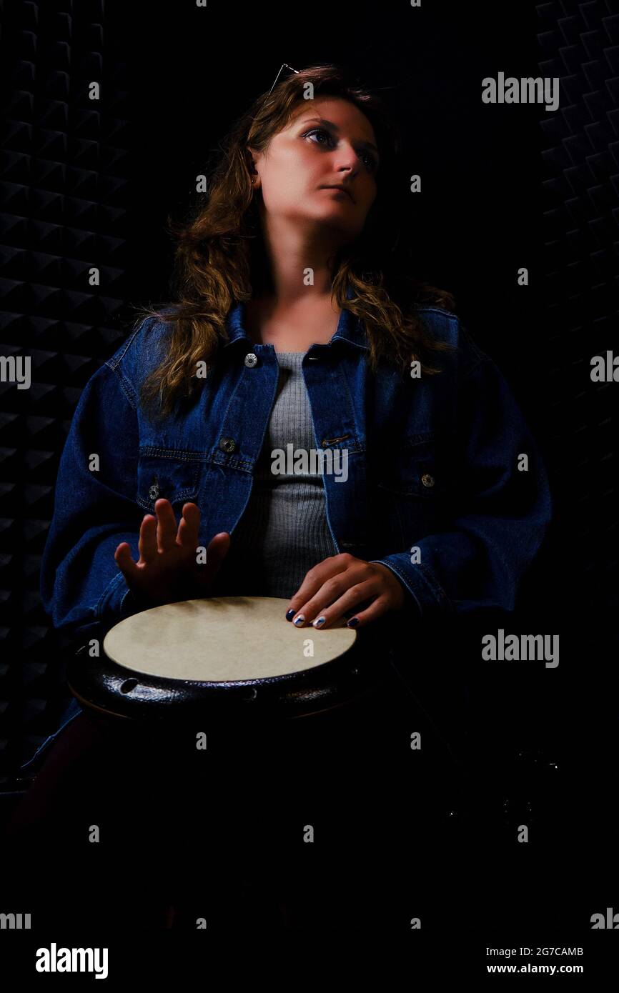 Playing on ethnic African percussion instrument Darbuka, horizontal ...