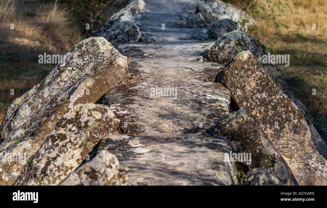 Antique run-down stone bridge over the stream Stock Photo - Alamy
