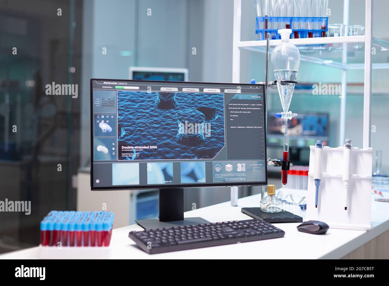 Computer with microbiology virus expertise on display standing on table ...