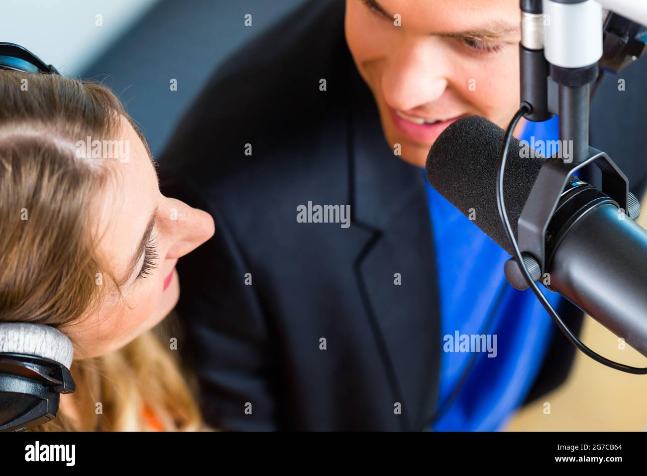 Presenters or moderators - man and woman - in radio station hosting ...