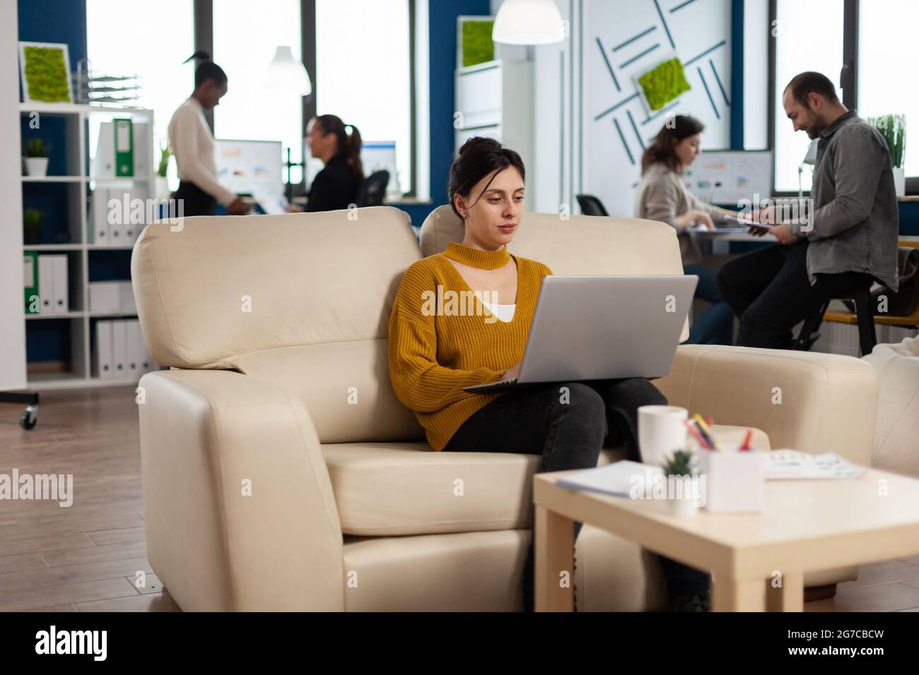 Diverse group people sitting couch hi-res stock photography and images ...