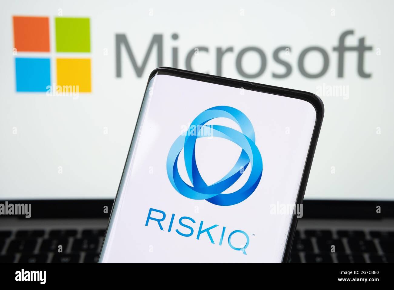RiskIQ company logo seen on the smartphone and Microsoft logo on the ...
