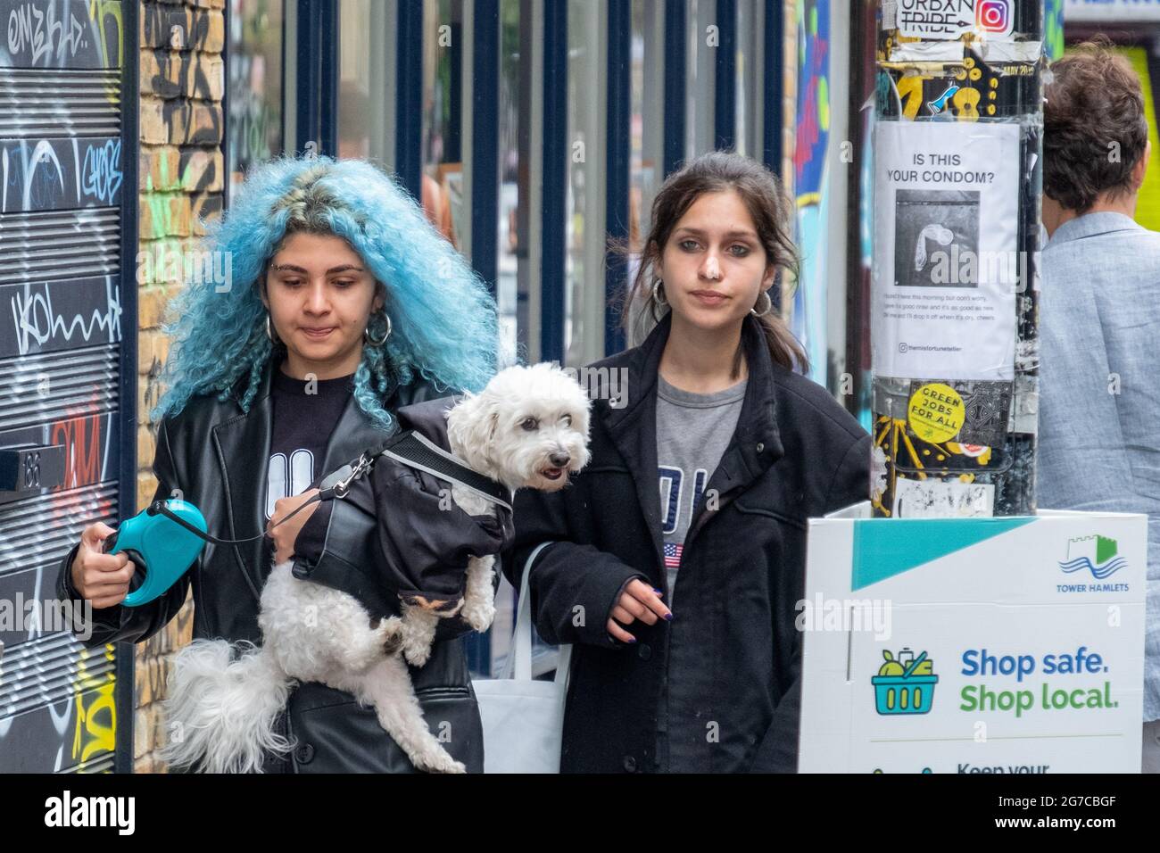 London- July, 2021: Hipsters with colourful hair on Brick Lane inb ...