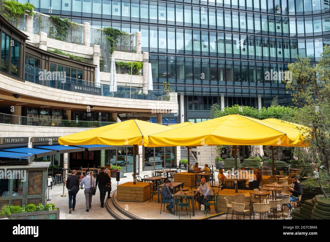 London- July 2021: Office workers sitting outside after work in ...