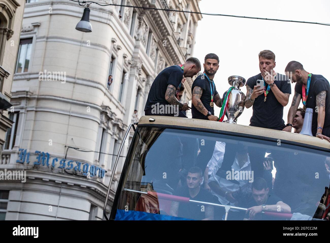 Rome, The open-top coach of the Italian National team passes in via del ...