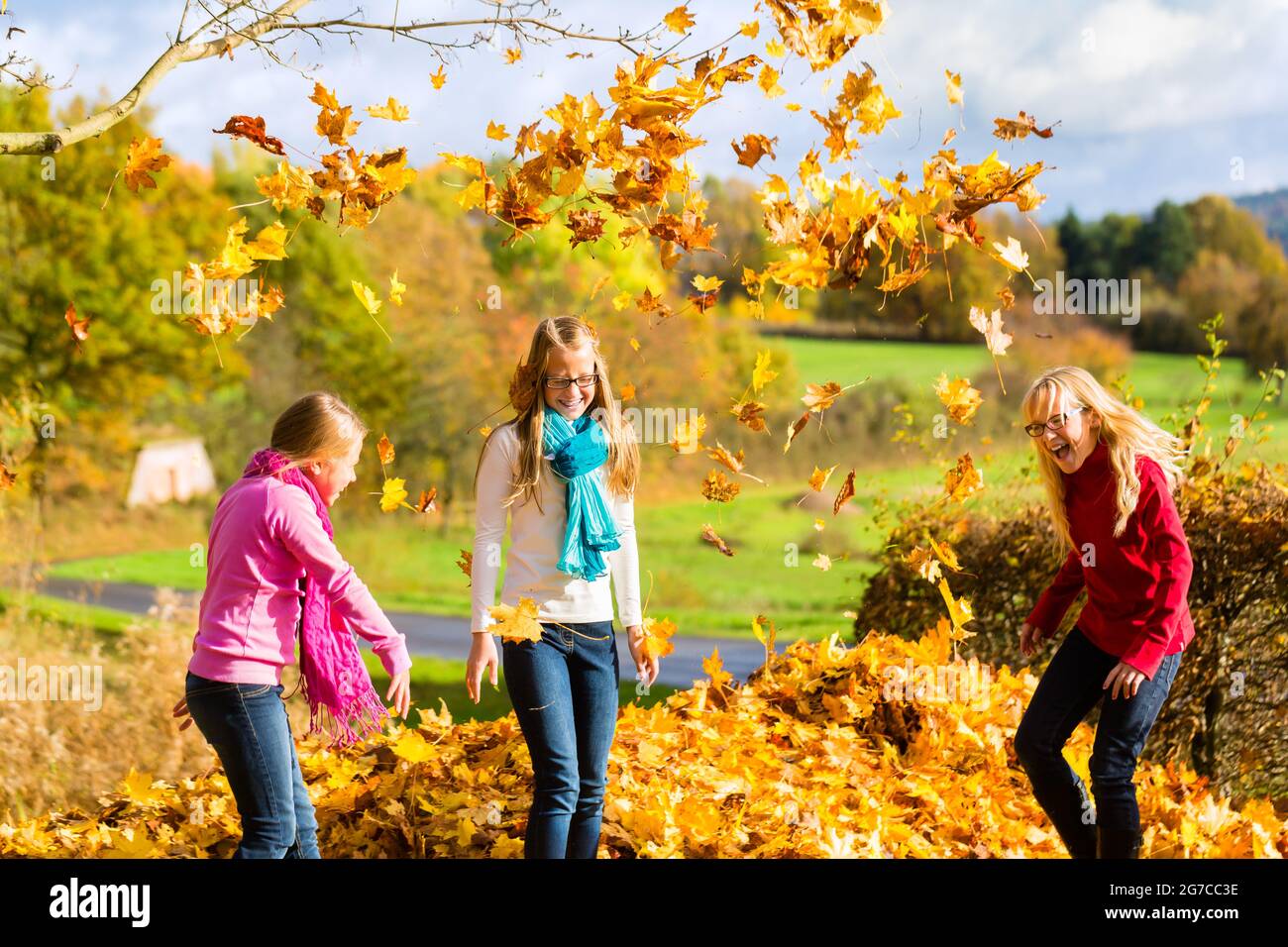 Autumn people with children with girls with outdoor leaves hi-res stock ...