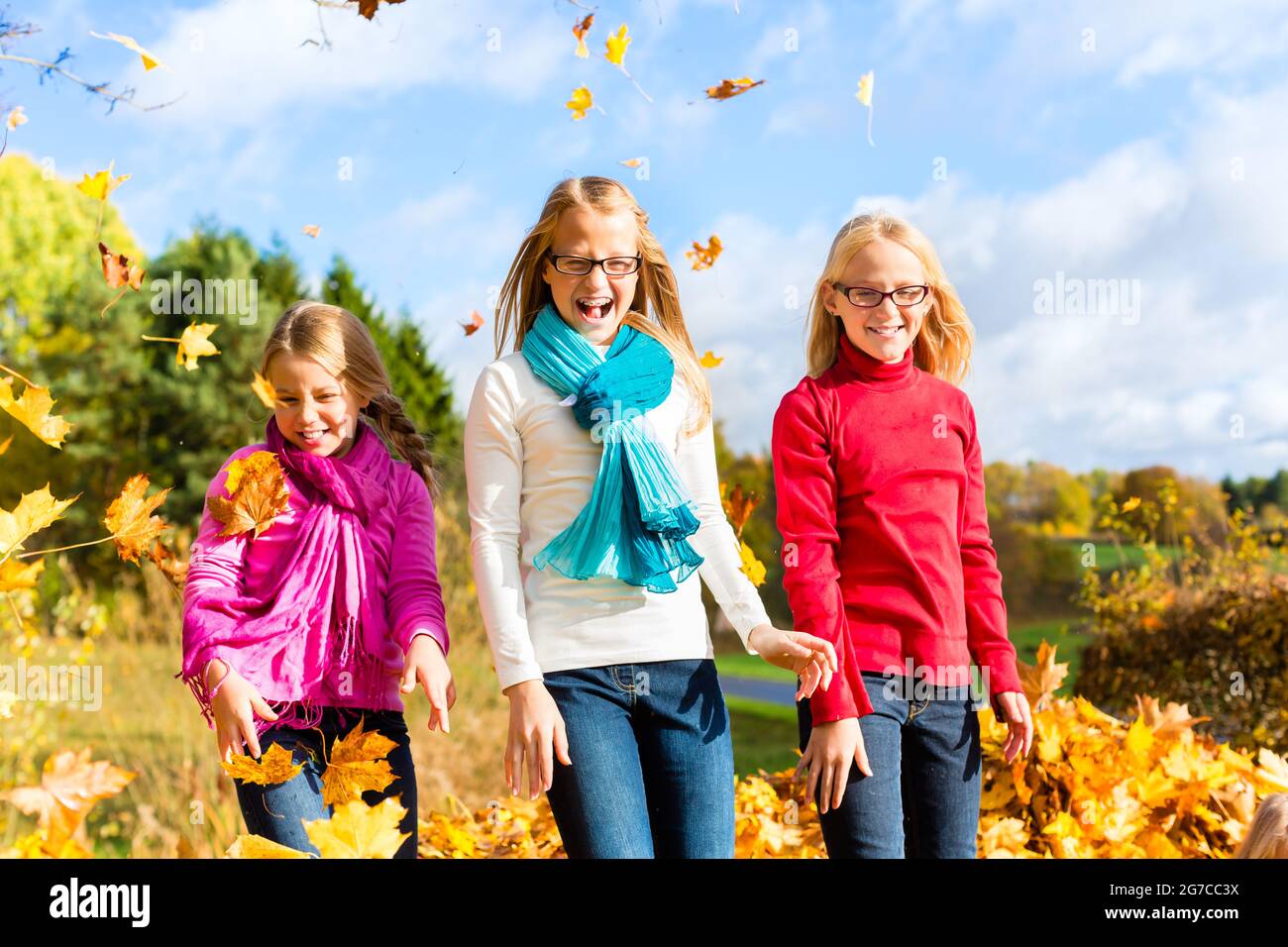 Fall for children with people and girls in park hi-res stock ...