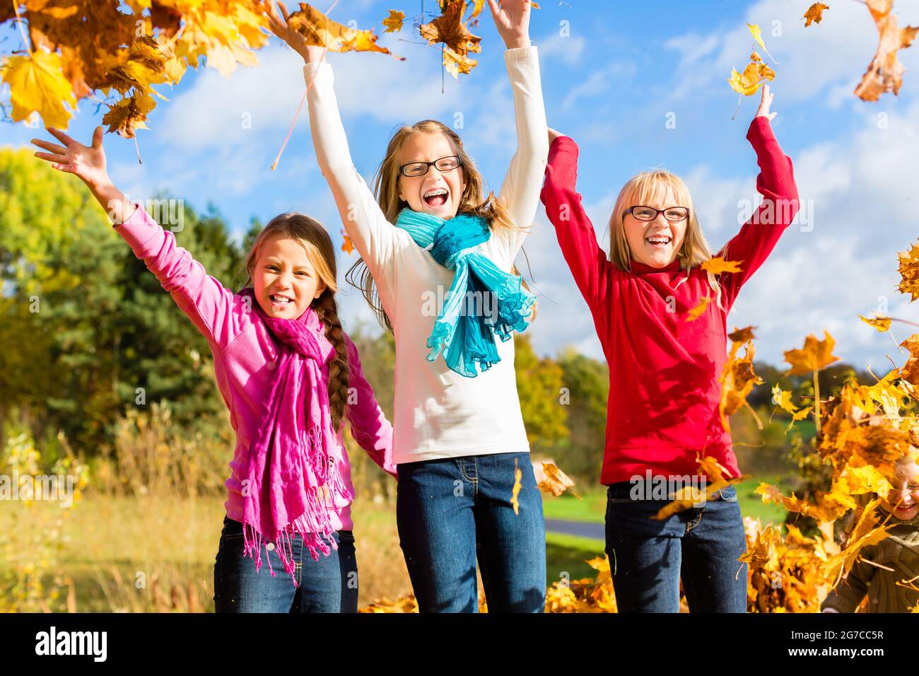 Fall for children with people and girls in park hi-res stock ...
