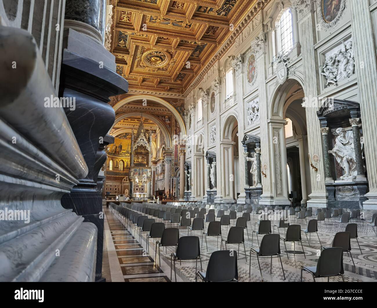 Chairs ready to welcome the faithful in the Rome cathedral of San ...