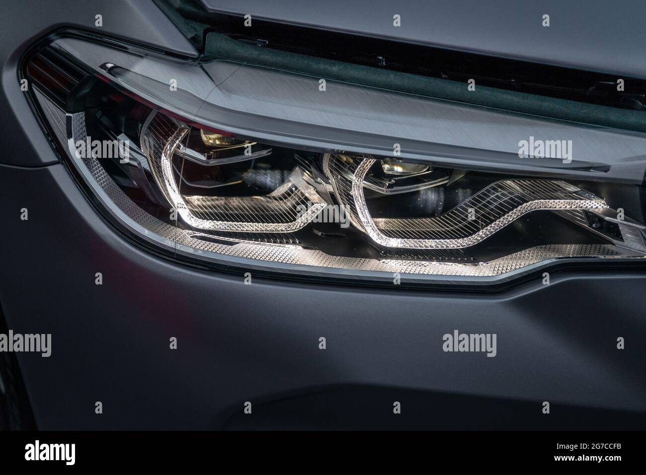 Close up part of automobile. The headlight of a modern luxury car from ...