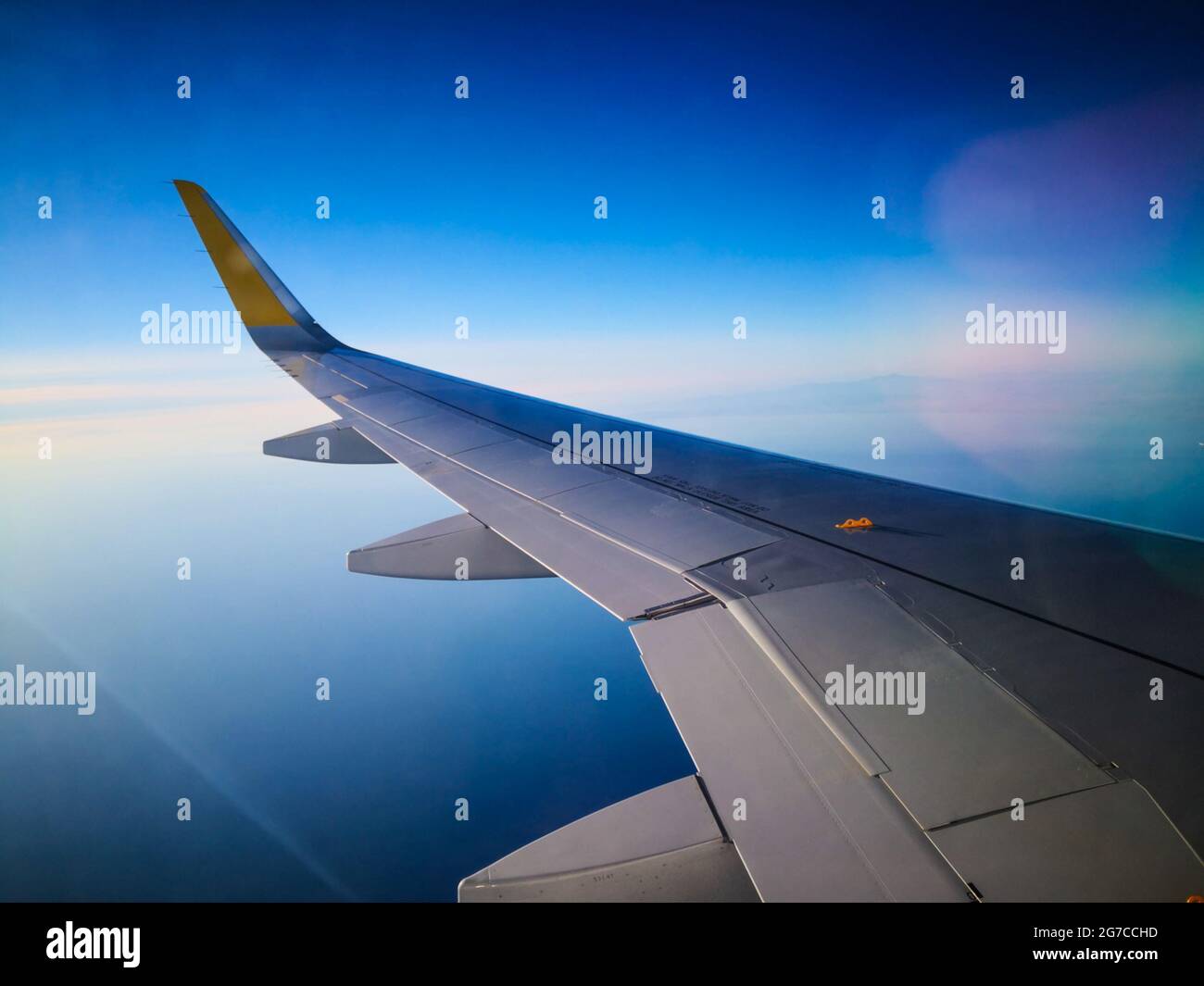 View of the jet plane wing and sky from passenger hi-res stock ...