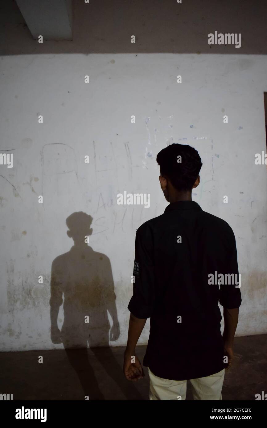 Man and his shadow Stock Photo - Alamy