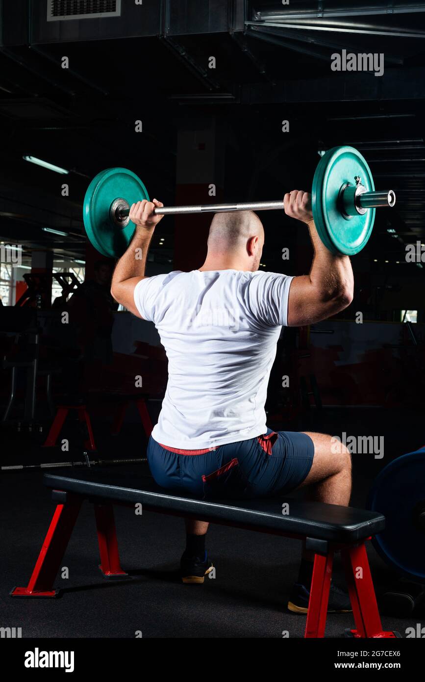 Young athlete lifts heavy barbell hi-res stock photography and images ...