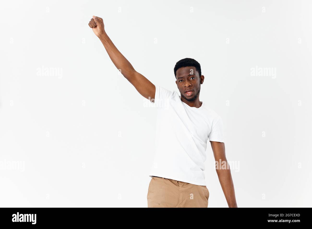emotional men of african appearance hold a hand from above on a light ...