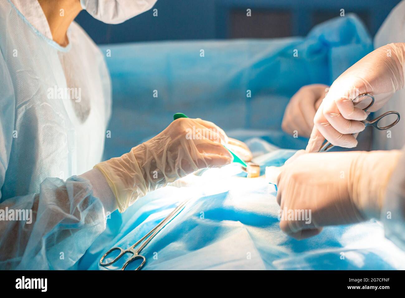 The senior surgeon in the operating room, where the patient is waiting ...
