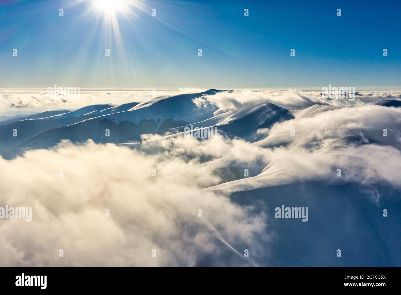 Autumn flight through blue sky in Carpatian autumn mountains aerial ...