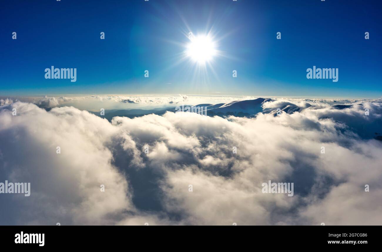 Autumn flight through blue sky in Carpatian autumn mountains aerial ...