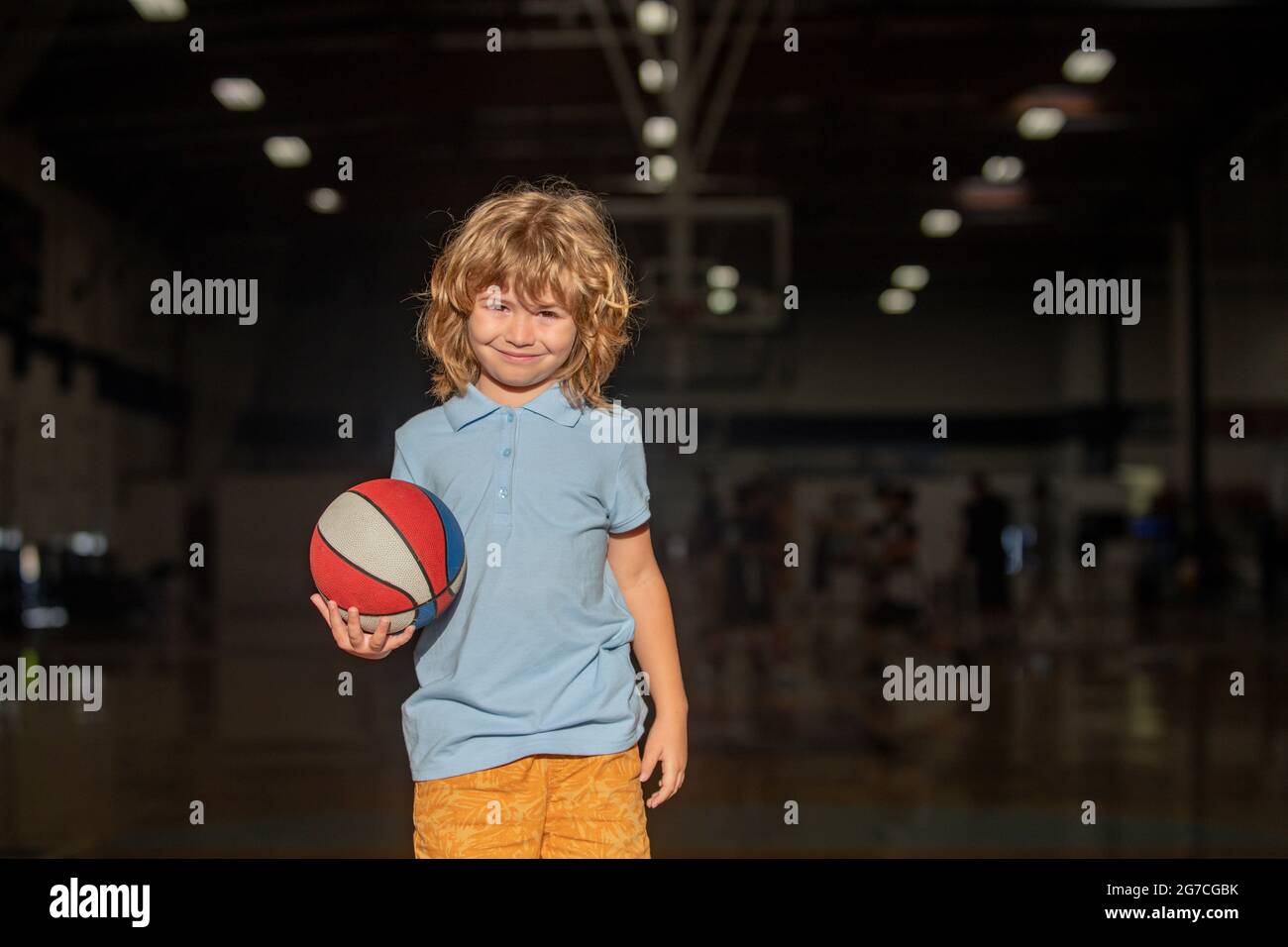 Kid playing basketball. Child basketball player at school Stock Photo ...