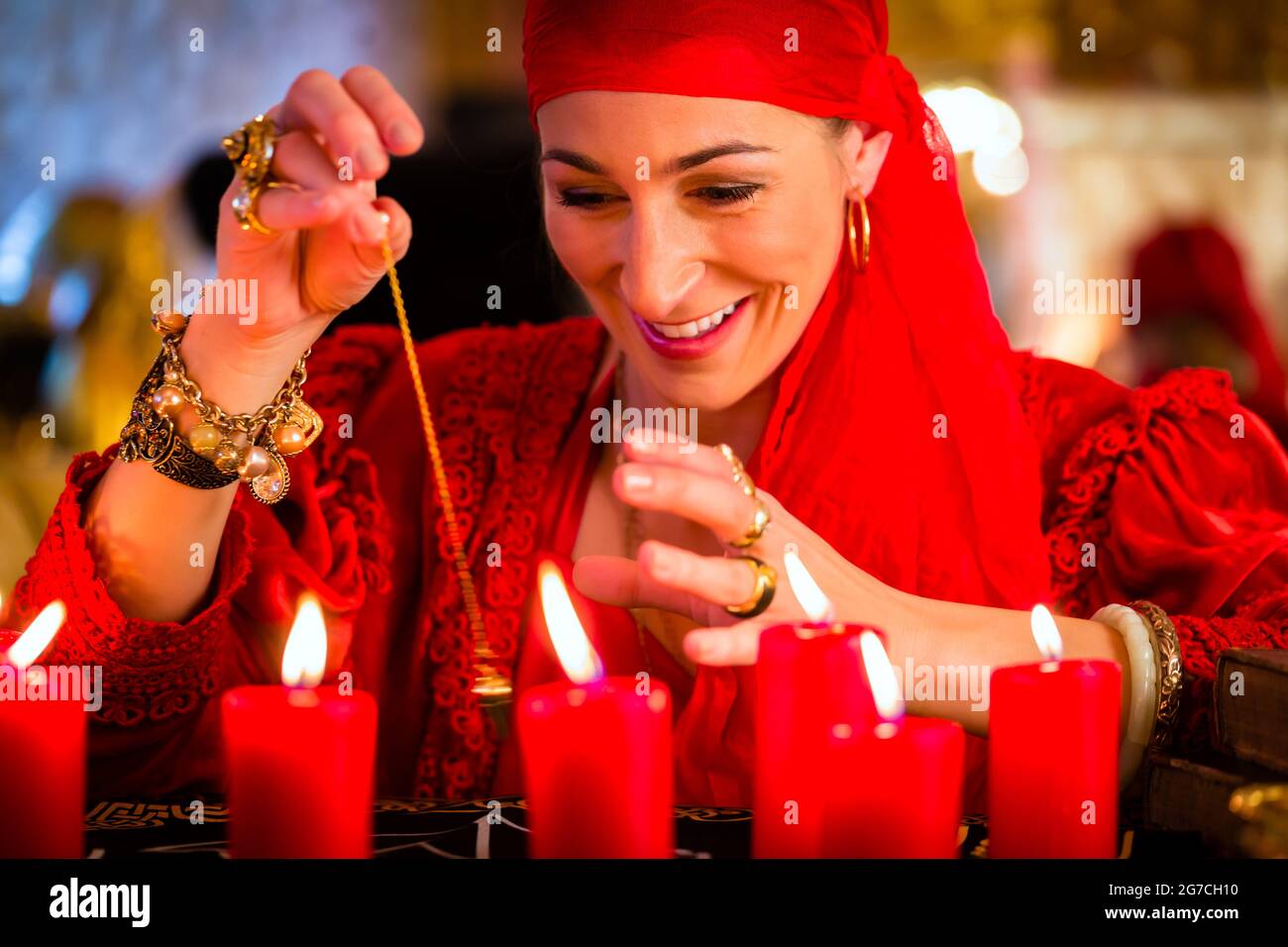 Female Fortuneteller or esoteric Oracle, sees in the future by dowsing ...