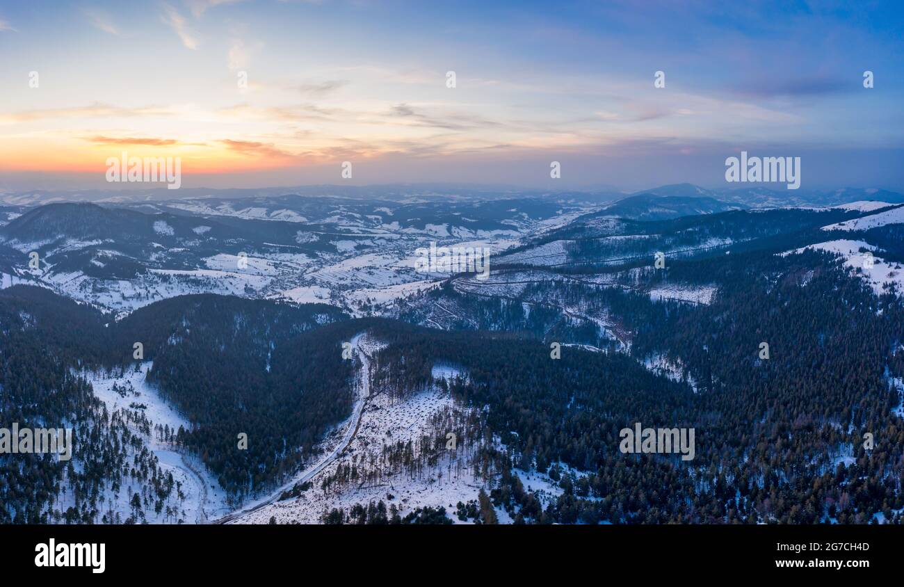 Aerial view of the mystical landscape of a winter mountain forest on a ...