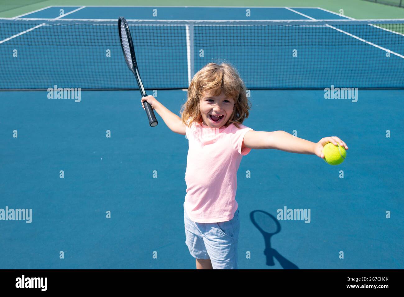 Kid tennis player on tennis court. Boy hitting forehand in tennis Stock ...