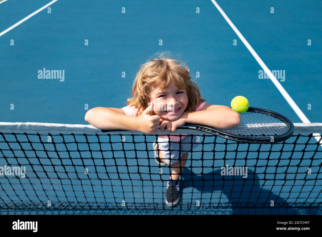Little boy playing tennis. Sport kids, thumbs up, winner. Child with ...