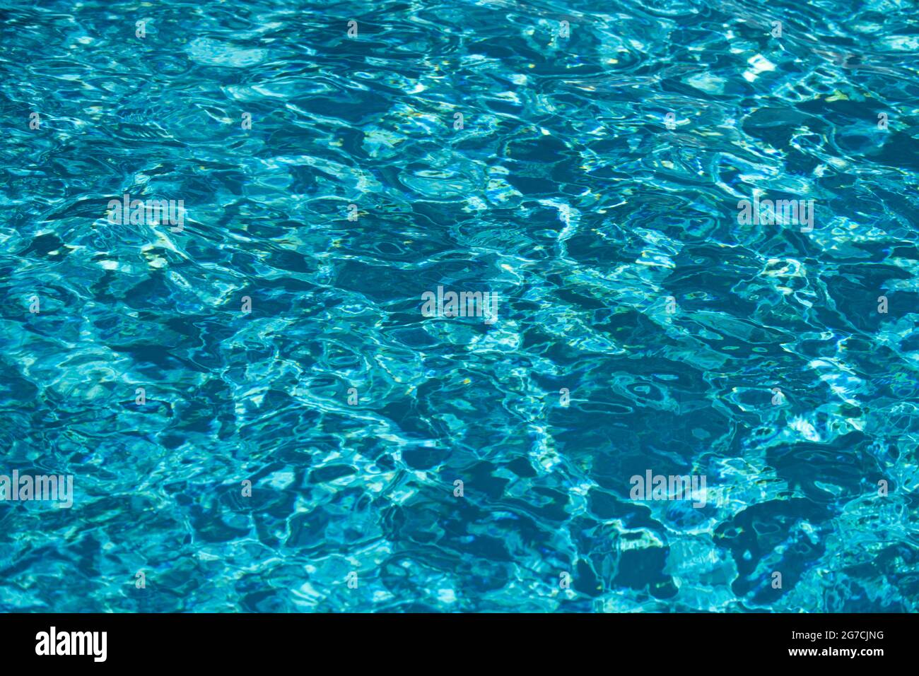 Abstract ripple wave and clear turquoise water surface in swimming pool ...