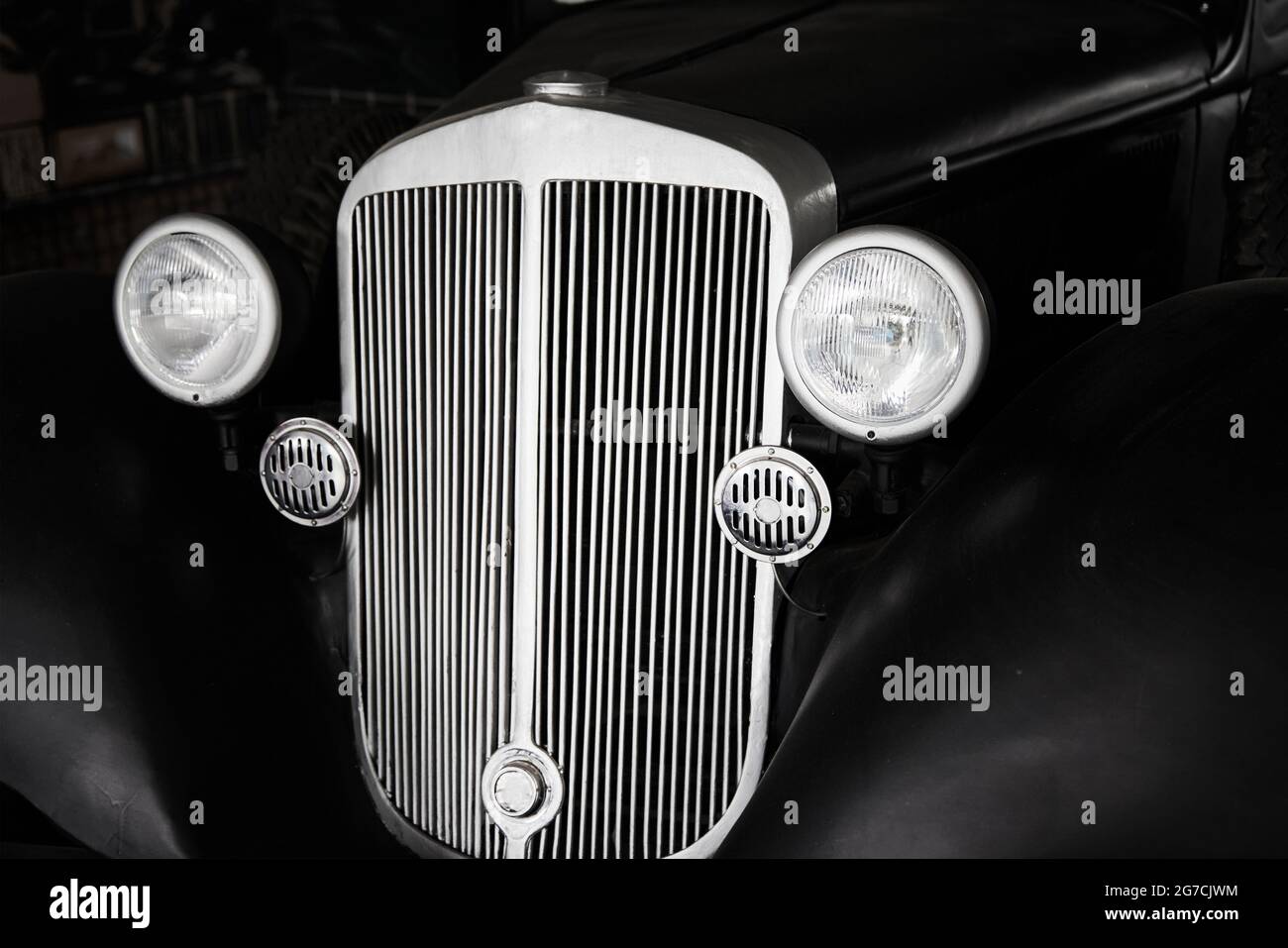 Detail of retro car. Radiator grille and headlight lamp on vintage car ...