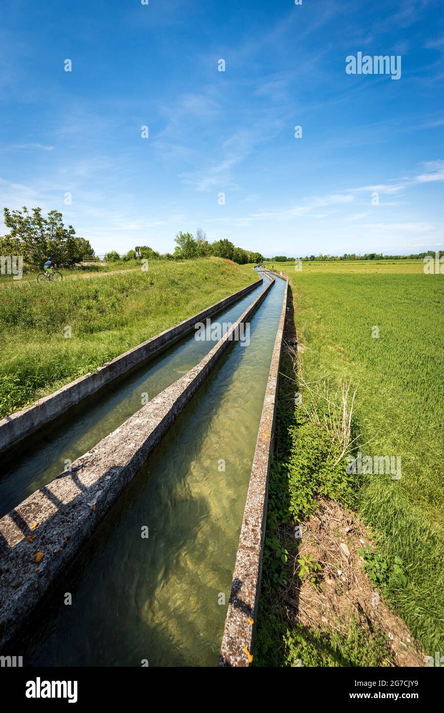 Two small concrete irrigation canals in a rural scene, Padan Plain or ...