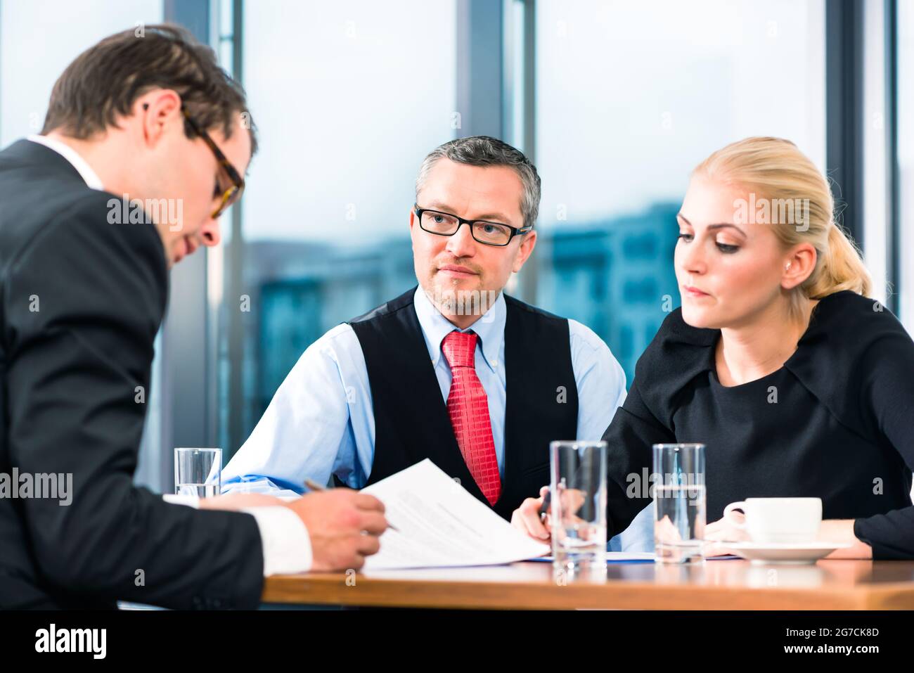 Business - young man in an Job interview, signs his employment contract ...