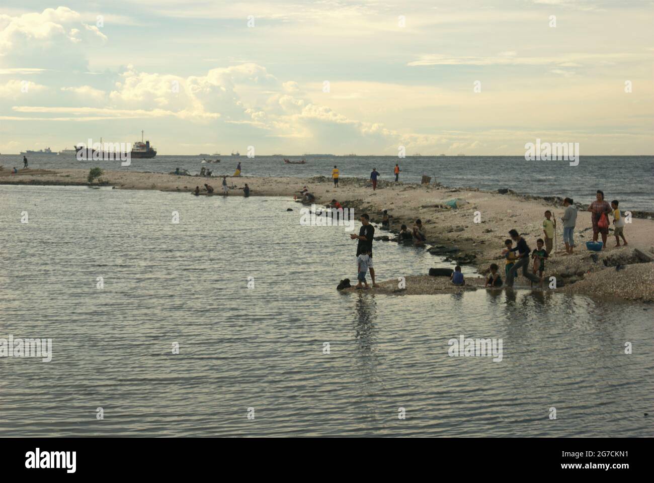 Jakarta, Indonesia. People having recreational time on the beach of ...