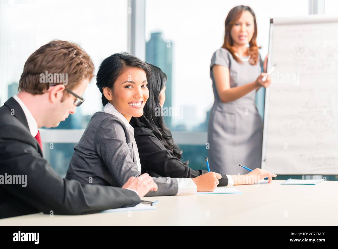 Asian businesspeople making notes hi-res stock photography and images ...