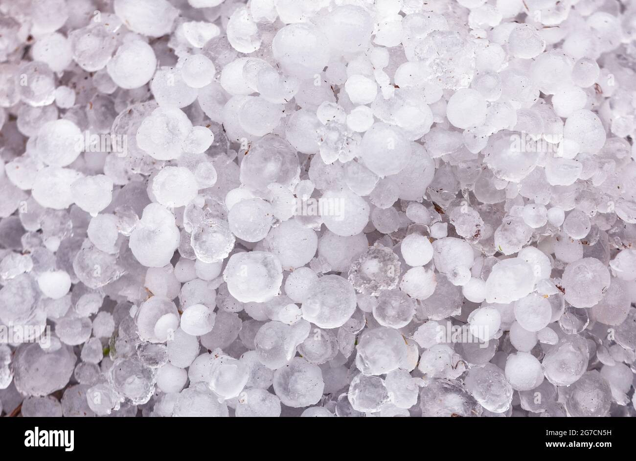 A pile of large hail on the ground Stock Photo - Alamy