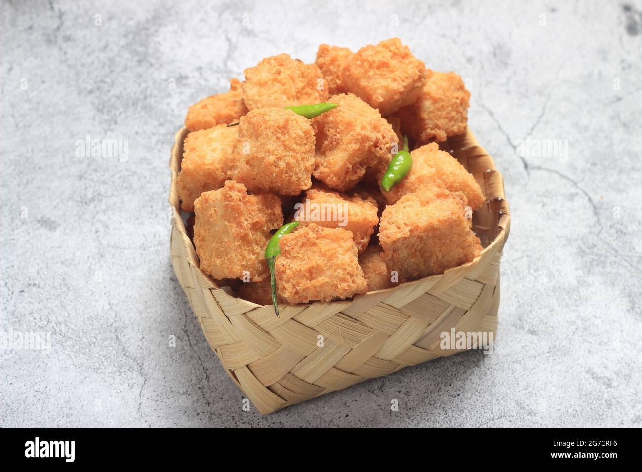 Photo Top View, tahu krispi or crispy Tofu and green chili at bamboo ...