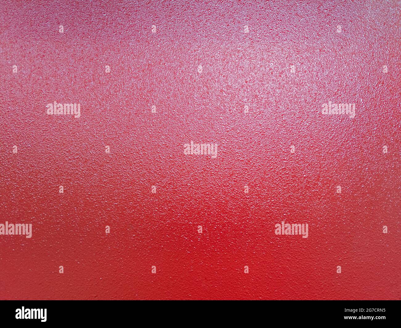 full frame bacground of red shagreen powder paint coating on flat sheet ...