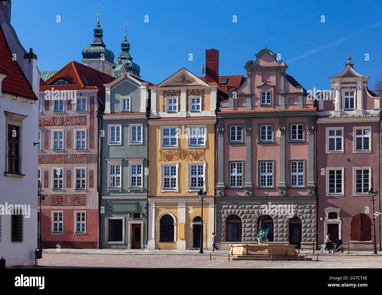 The colorful facades of medieval houses in the market square on a sunny day. Poznan Poland Stock ...