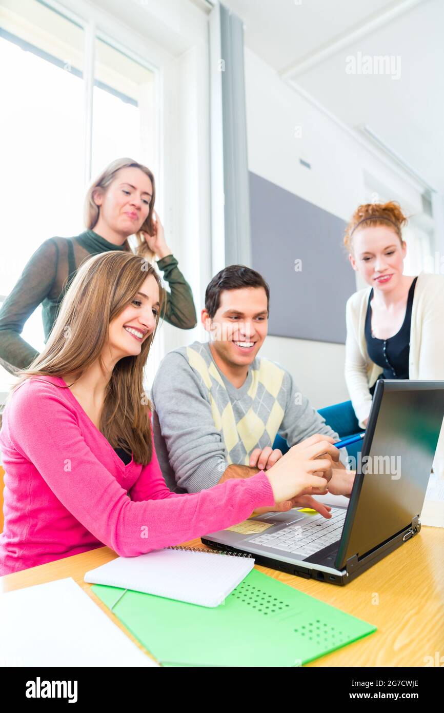 University college students using laptop for project team work learning ...
